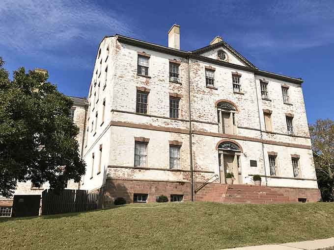 Sunlight on weathered brick can't quite soften the imposing grandeur of this Georgian mansion where royal governors once ruled.