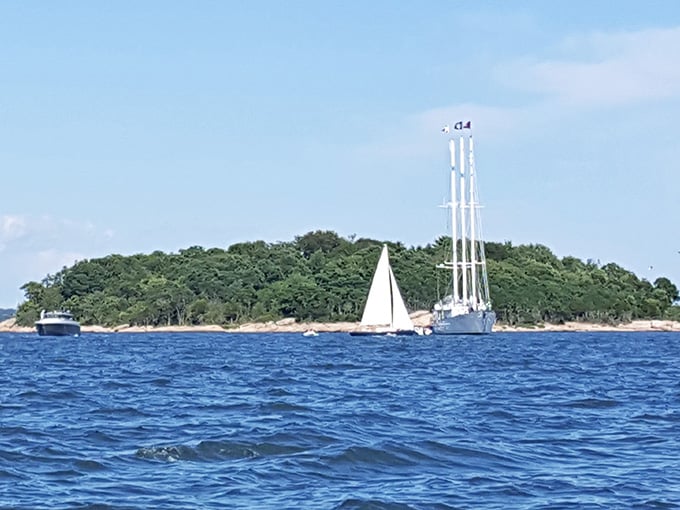 Picture-perfect islands dot the sparkling blue waters like scattered emeralds from a giant's treasure chest.