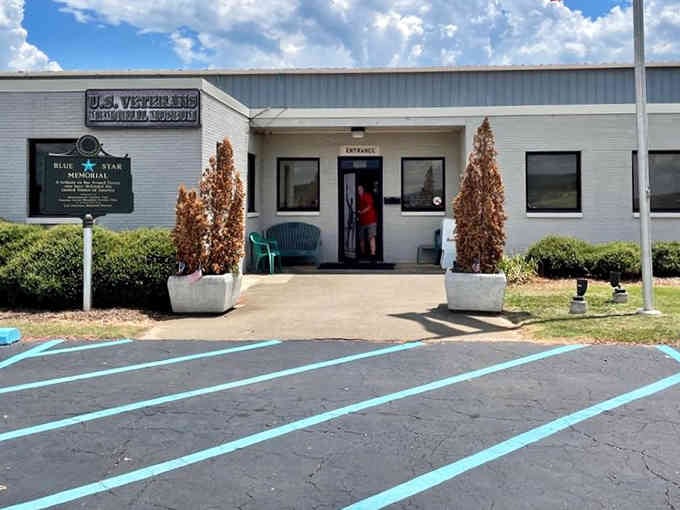 The unassuming entrance belies the powerful stories of courage and sacrifice waiting inside these walls.