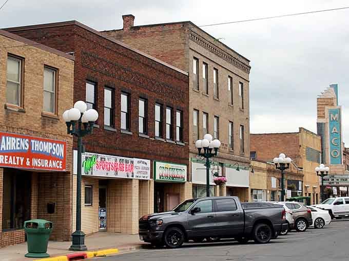 Vintage lampposts line streets where local businesses have served generations of families with genuine Midwestern hospitality.