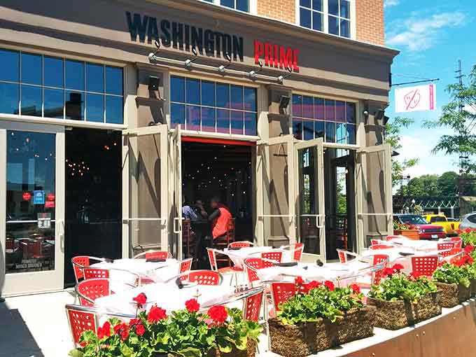 Bright red checkered tablecloths on the patio bring cheerful Italian trattoria vibes to your American steakhouse experience.