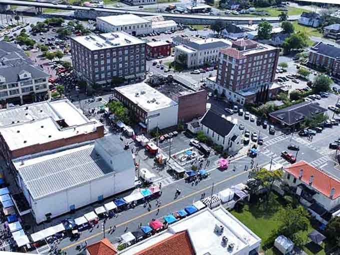 Market tents and historic buildings create a Saturday morning scene that beats any farmers market in the big city.
