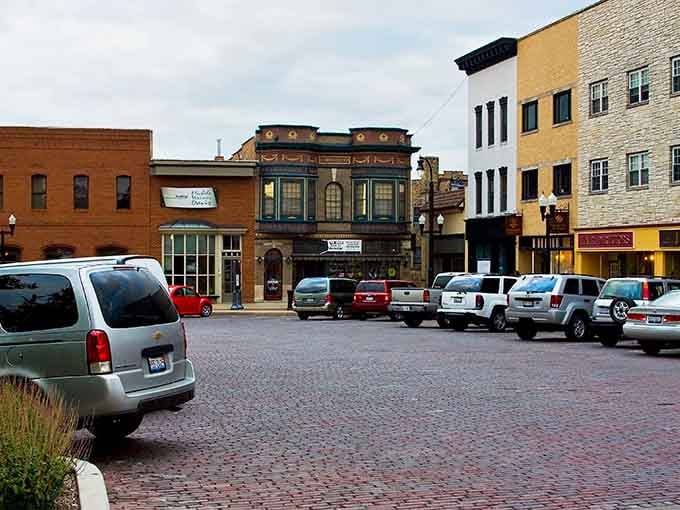 Brick streets and vintage storefronts create a scene your parents would recognize from their own childhood memories.