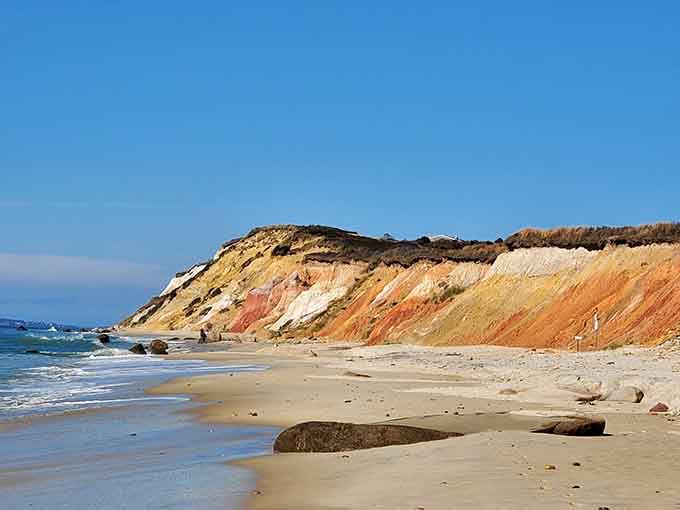 These striped clay cliffs tell millions of years of Earth's story in brilliant oranges, reds, and creamy whites.