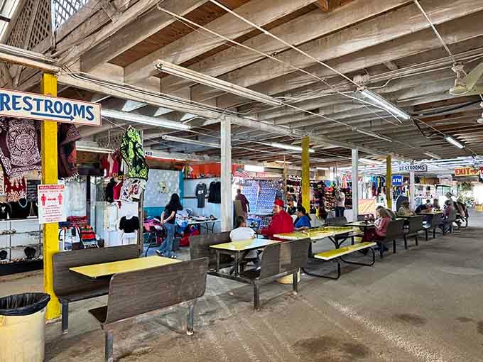 That industrial ceiling stretches forever while shoppers navigate aisles packed with deals that make your membership warehouse look overpriced.