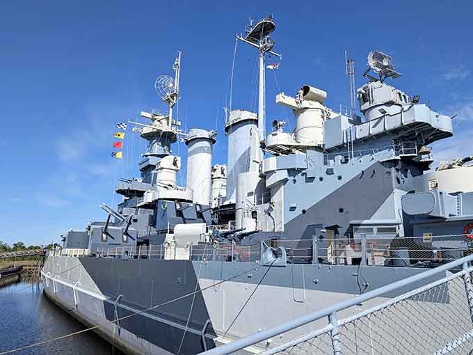 The battleship's towering superstructure reaches skyward like a steel monument to the sailors who served aboard her.