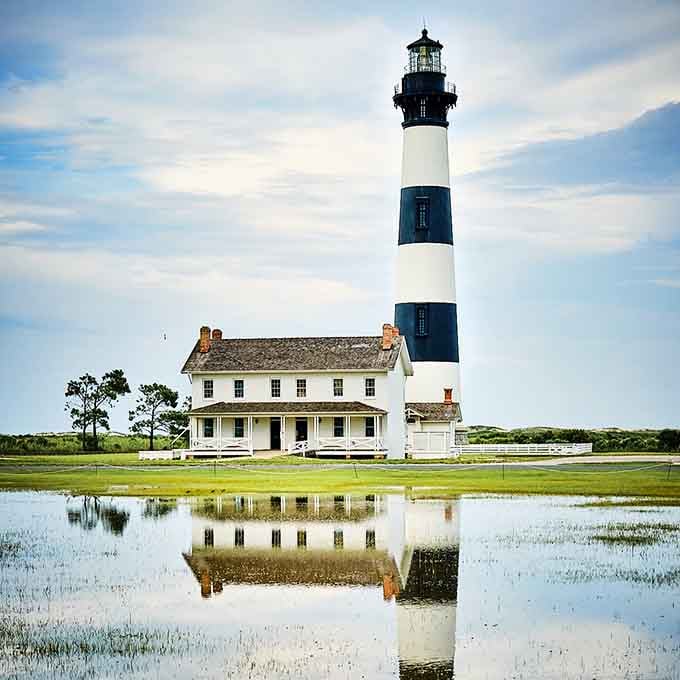 Like a mirror reflecting perfection, the still water doubles the beauty of this iconic coastal sentinel.