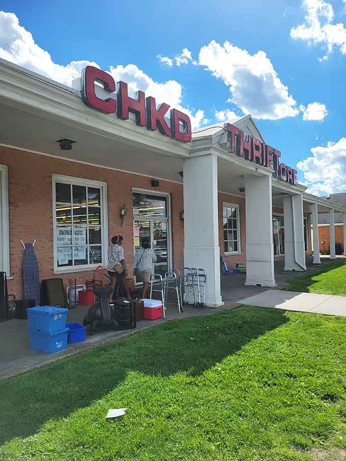 Shoppers browse the outdoor displays under perfect blue skies, finding treasures before even stepping through the doors.