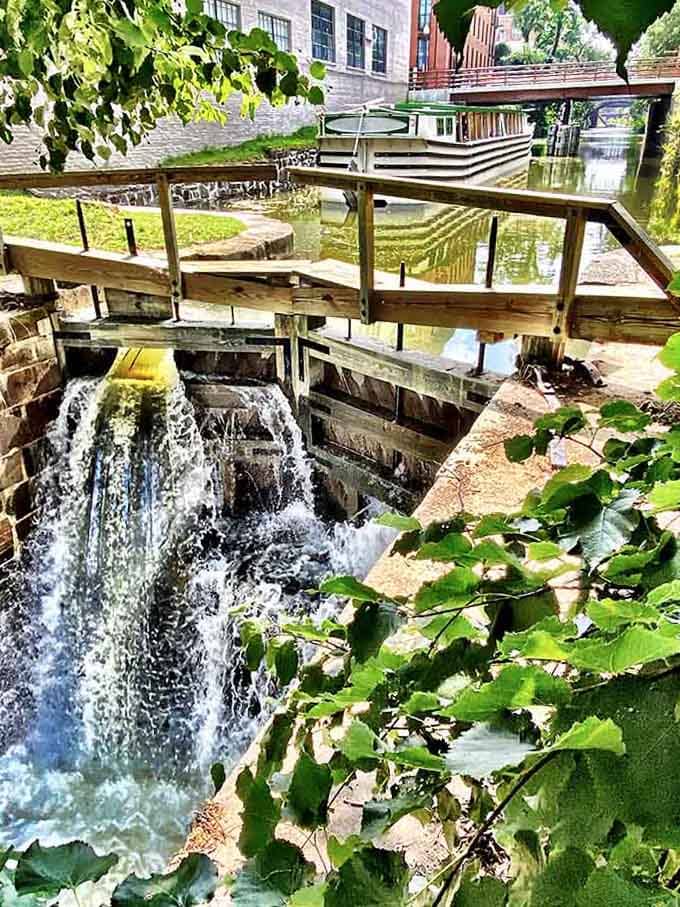 Water cascades through wooden locks in a scene straight from the 1800s, where engineering meets nature in perfect balance.