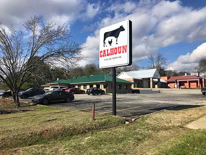 That bold sign stands tall like a lighthouse guiding hungry travelers to their carnivorous happy place.