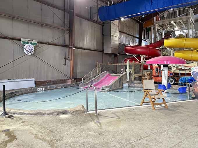 Those colorful slides spiral down like ribbon candy, each one promising a different kind of stomach-dropping excitement and laughter.