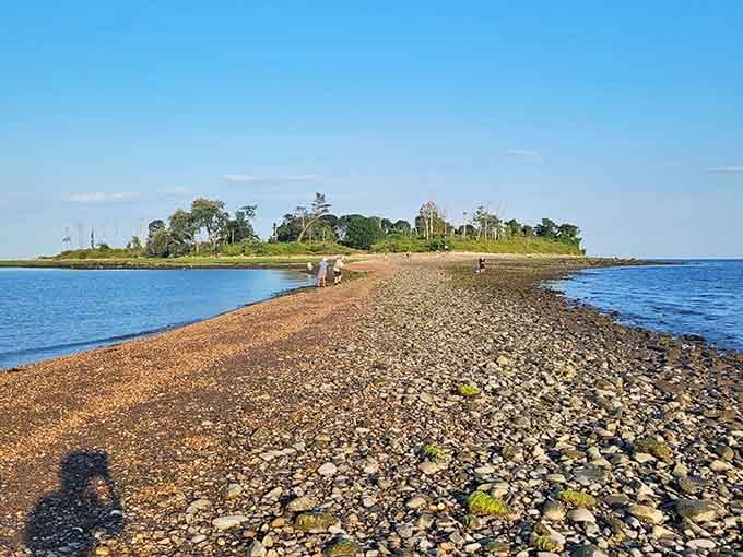 That rocky path stretching toward the island looks like something from a pirate's treasure map.