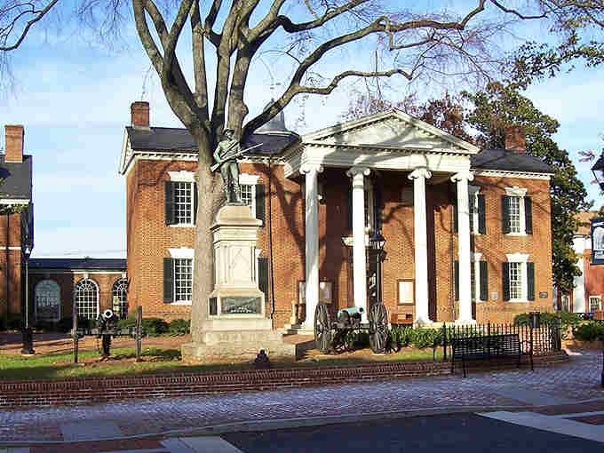 Those white columns say "Southern elegance" louder than any welcome sign ever could in this historic square.