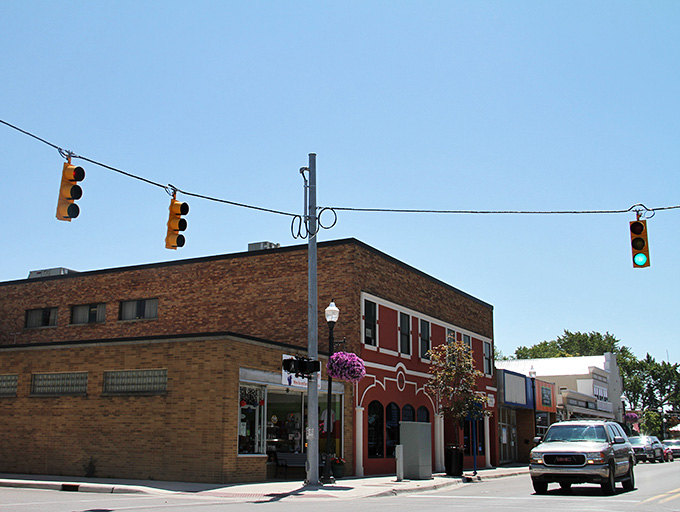 Hanging flower baskets add splashes of color to brick buildings that have welcomed generations of smart retirees.
