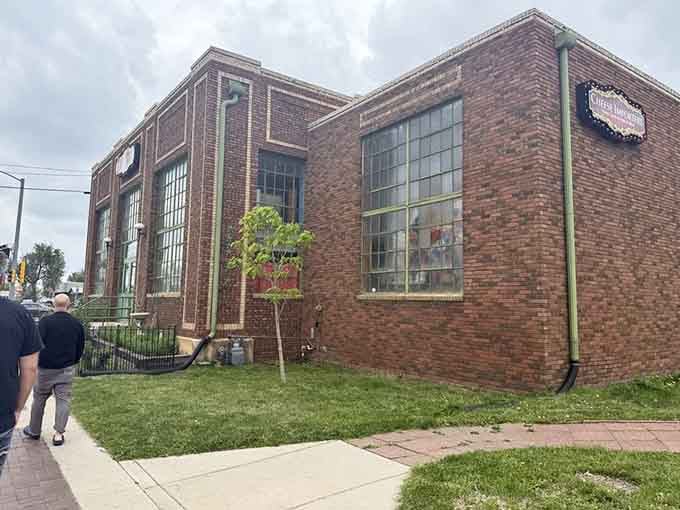 Industrial windows and weathered brick transform a former warehouse into the kind of authentic space where real flavor lives.