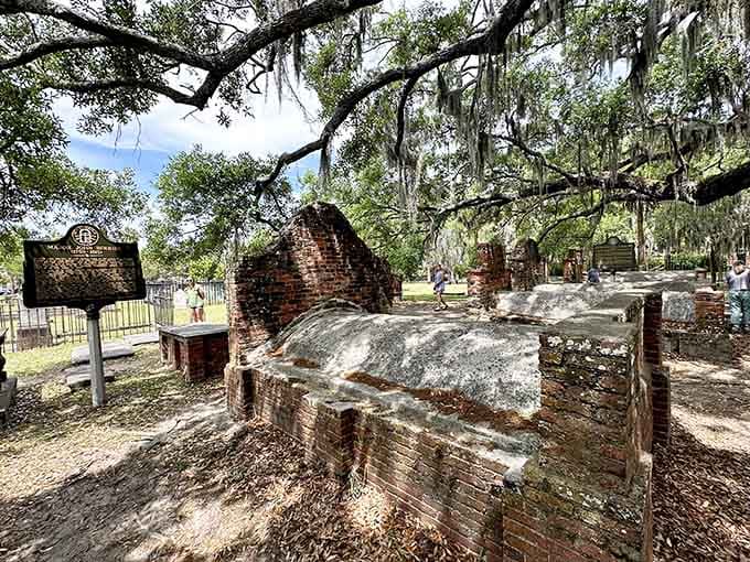 Weathered brick vaults and historical markers rest under ancient trees where time moves differently than anywhere else.