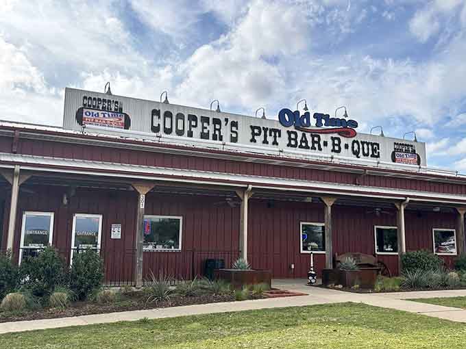 Blue sky meets red barn in a scene so perfectly Texan, you half expect John Wayne to walk out.