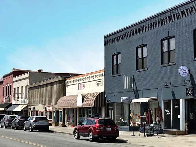 Historic brick buildings stand shoulder-to-shoulder like old friends sharing secrets from a century of community gatherings.