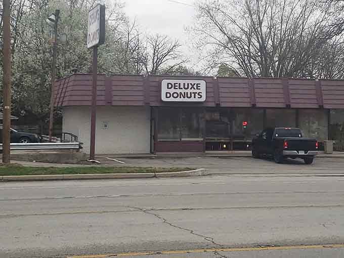 Bare trees frame this unassuming corner gem, proving the best donut shops don't need fancy exteriors to deliver delicious goods.
