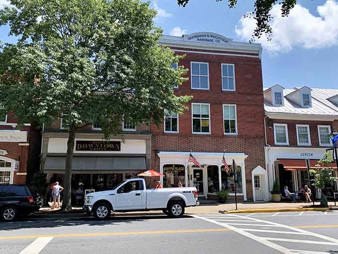 Brick buildings wear their history proudly along streets where George Washington himself might have walked during the Revolution.