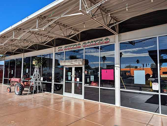 Behind those glass doors, Sonoran hot dogs are getting wrapped in bacon and loaded with toppings that defy gravity.