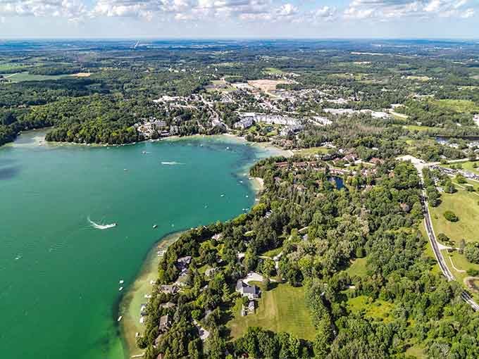 From above, Elkhart Lake sparkles like an emerald jewel surrounded by forests, beaches, and the promise of perfect retirement days.