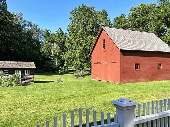 The red barn stands proud against summer green, a postcard-perfect scene from America's simpler days gone by.