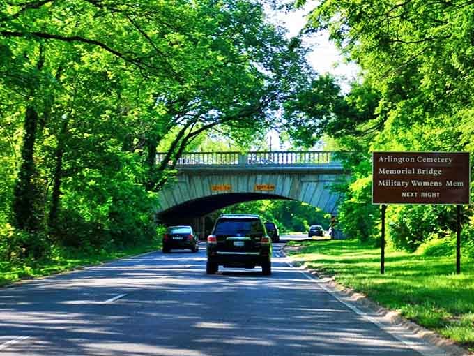 That elegant bridge arching overhead whispers history while modern cars zip beneath its timeless brick construction.