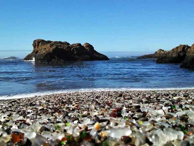 Nature's recycling program turned broken bottles into a sparkling carpet of sea glass treasures along the shore.