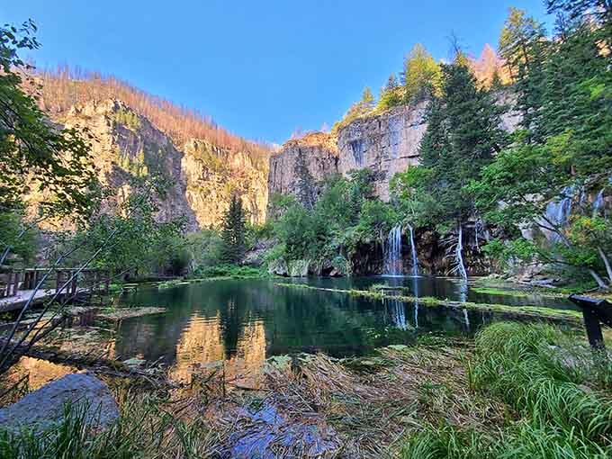 Evening light transforms the limestone cliffs and cascading falls into a painter's dream of greens and golds.