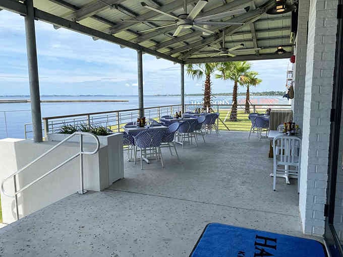 That covered patio overlooking the bay makes every meal taste better, like eating with a postcard view.