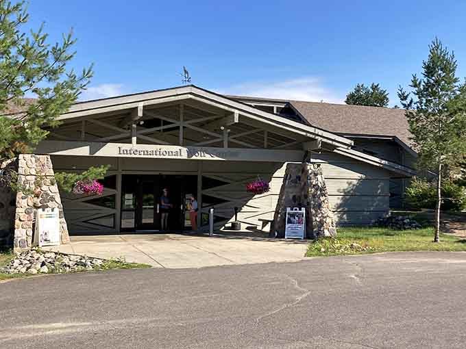 Bright petunias soften the lodge-style facade, welcoming guests to discover the mysteries of Minnesota's most misunderstood predator.