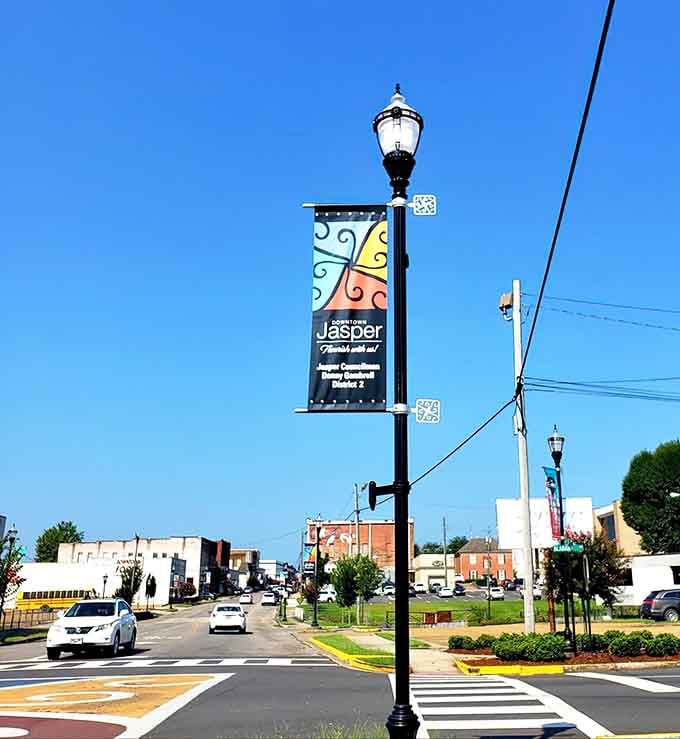 Colorful banners wave hello from lamp posts, proving that small towns know how to roll out the welcome mat.