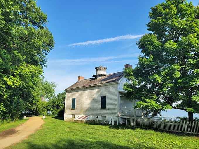 The white picket fence and weathered siding create a scene so perfectly American, Norman Rockwell would've grabbed his brushes.