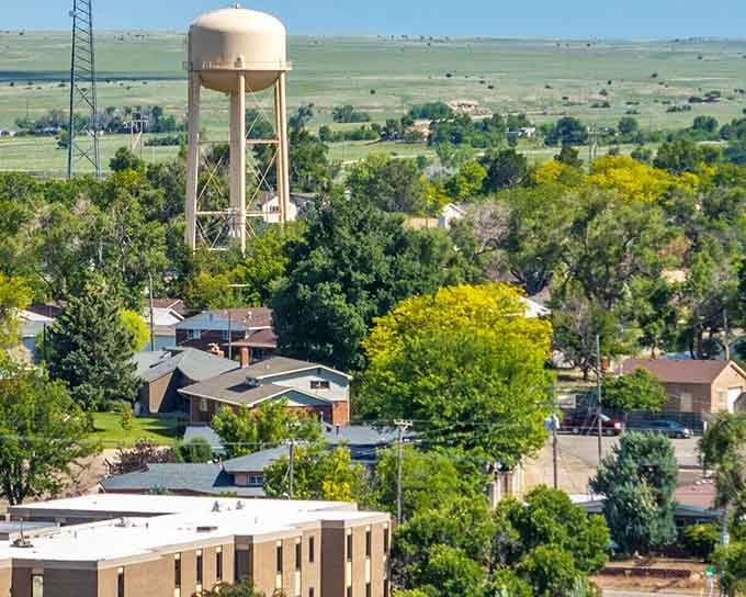 Classic heartland vista&mdash;where the water tower's the tallest landmark and the green canopy shelters stories spanning generations.