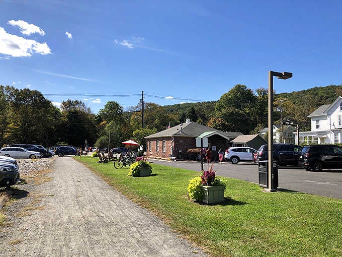 Rolling green lawns and mountain backdrop frame this peaceful village scene where time seems to move more slowly.