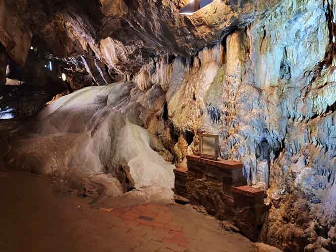 The cave walls shimmer with mineral deposits creating a natural light show that no theme park could ever replicate.