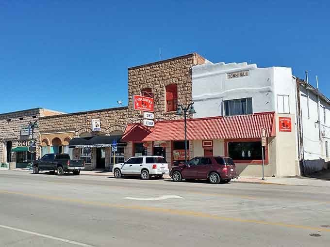 That red awning beckons like a lighthouse for hungry travelers seeking authentic small-town Colorado charm and character.