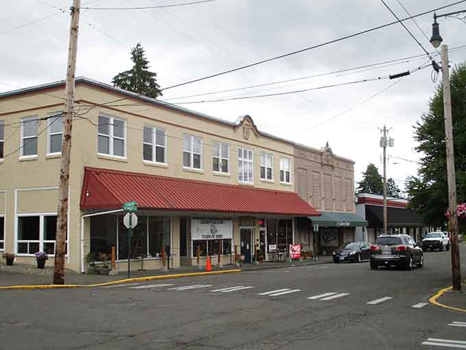 Red awnings pop against pale buildings, creating a scene Norman Rockwell would've sketched in his sleep.