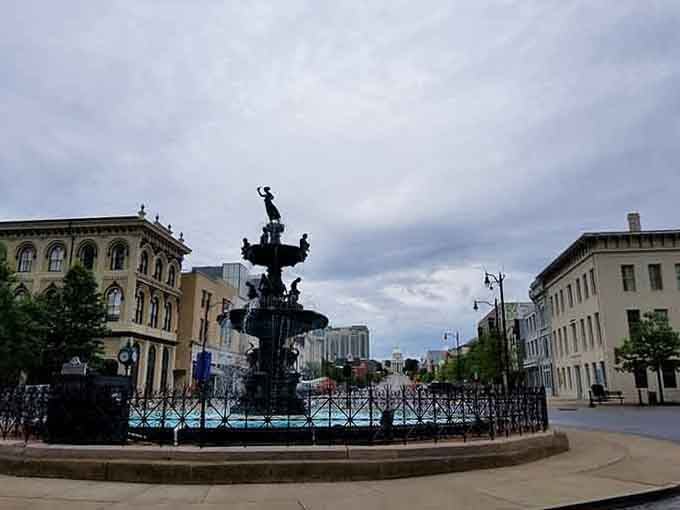 This ornate fountain anchors a historic square where Southern elegance meets modern city living perfectly.