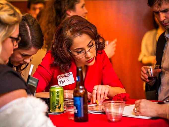 Red-suited sleuths gather around the table, piecing together clues between bites of dinner and sips of intrigue.
