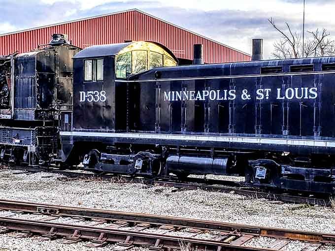 The Minneapolis & St. Louis locomotive rests quietly, its dark blue paint telling stories of countless miles traveled.