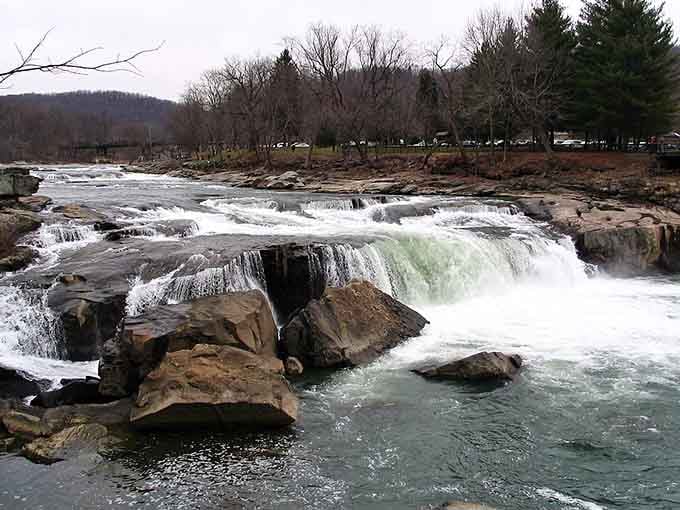 Raw power meets natural beauty as whitewater crashes over ancient rocks, creating nature's own thunderous symphony for visitors.