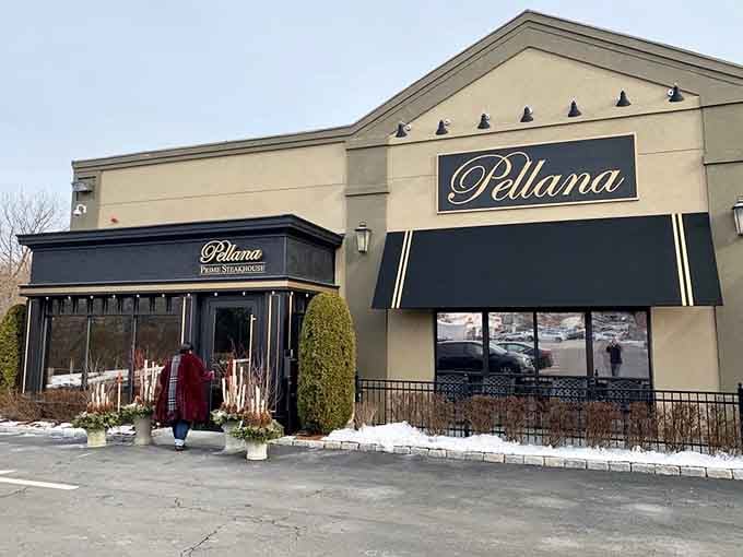 Winter snow frames the entrance like nature's own welcome mat, inviting you into warmth and wonderful flavors inside.