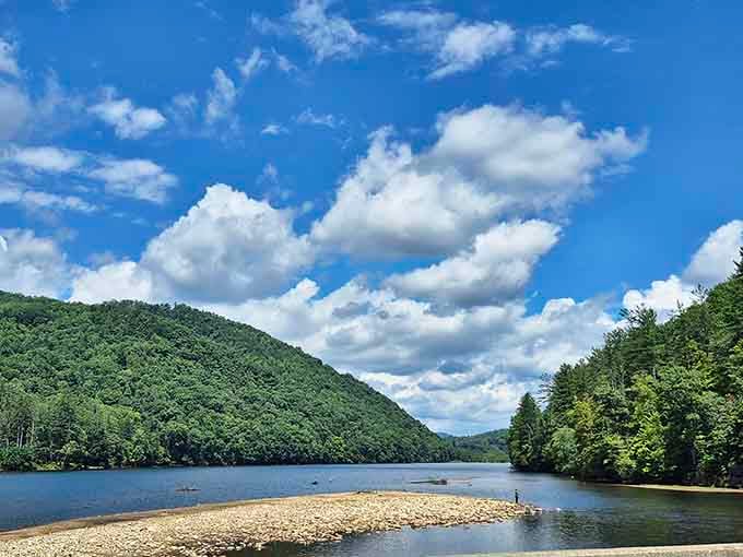 Crystal-clear water meets pristine shoreline under cotton-candy clouds in this mountain paradise that costs nothing to enjoy.