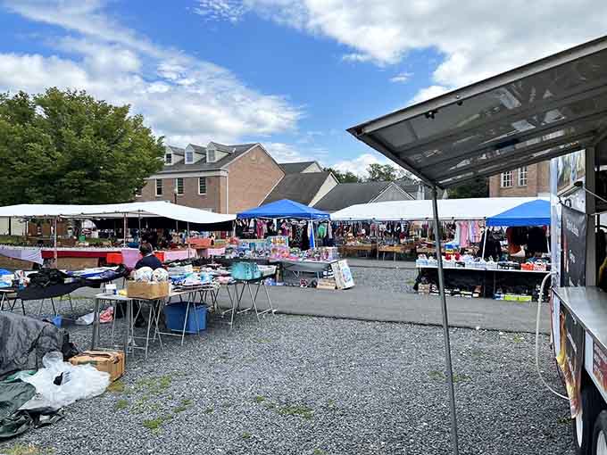 White tents stretch toward historic buildings, creating a charming blend of old-world atmosphere and modern shopping excitement.