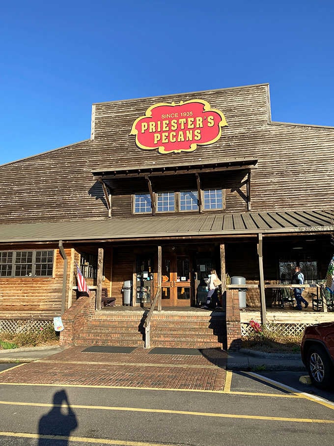 That wide front porch and weathered wood exterior whisper stories of generations stopping by for Southern hospitality and nutty desserts.