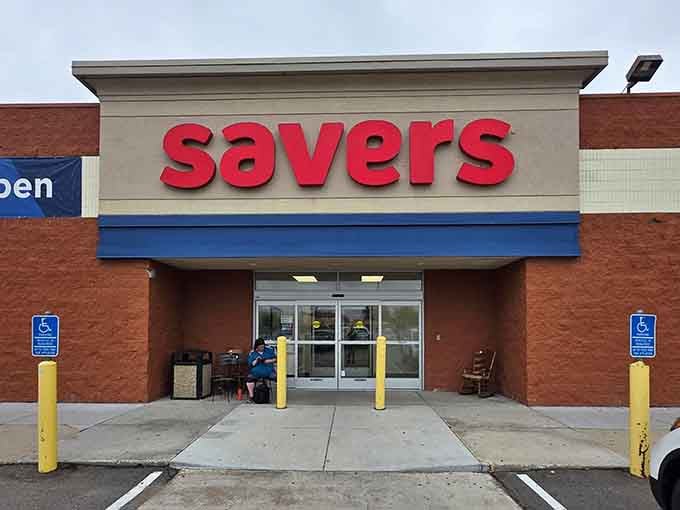 A patient shopper waits by the entrance, probably planning their strategic route through racks of hidden gems.