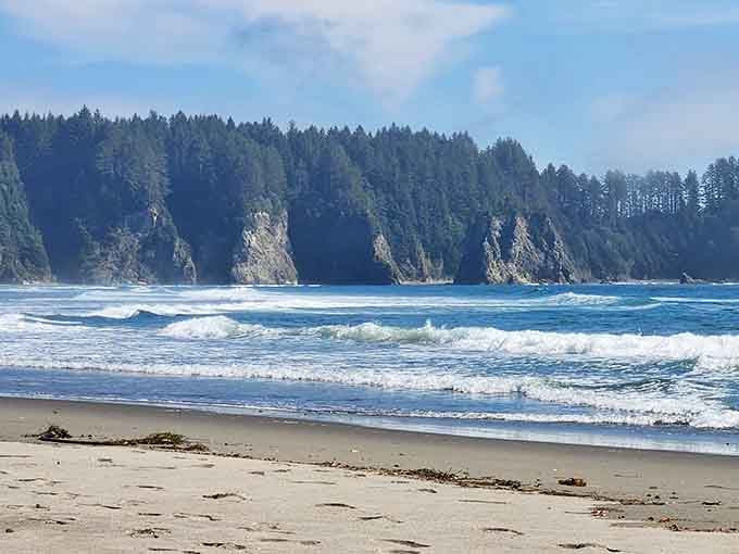 Perfect waves roll toward shore in endless rhythm, creating the kind of surf break that makes surfers relocate.