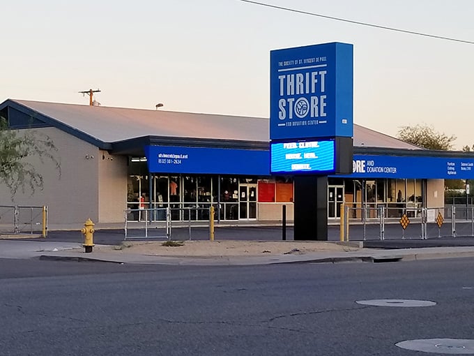 The towering sign glows against the evening sky, marking the spot where bargains and community spirit meet perfectly.
